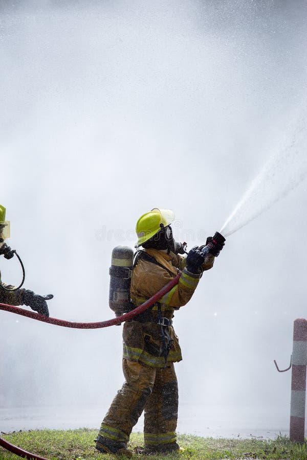 Fireman on the fire stock photo. Image of mask, firefighter - 146277286