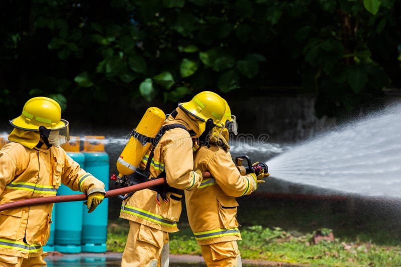 Fire Fighter In Full Gear Standing Outside A Steel Building Ready To Go ...