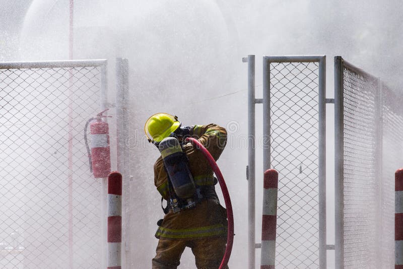 Fireman on the fire stock photo. Image of clothing, protective - 144116124