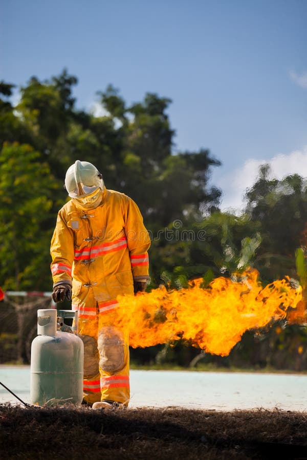 Fireman with Fire and Suit for Protect Fire Fighter Stock Image - Image ...