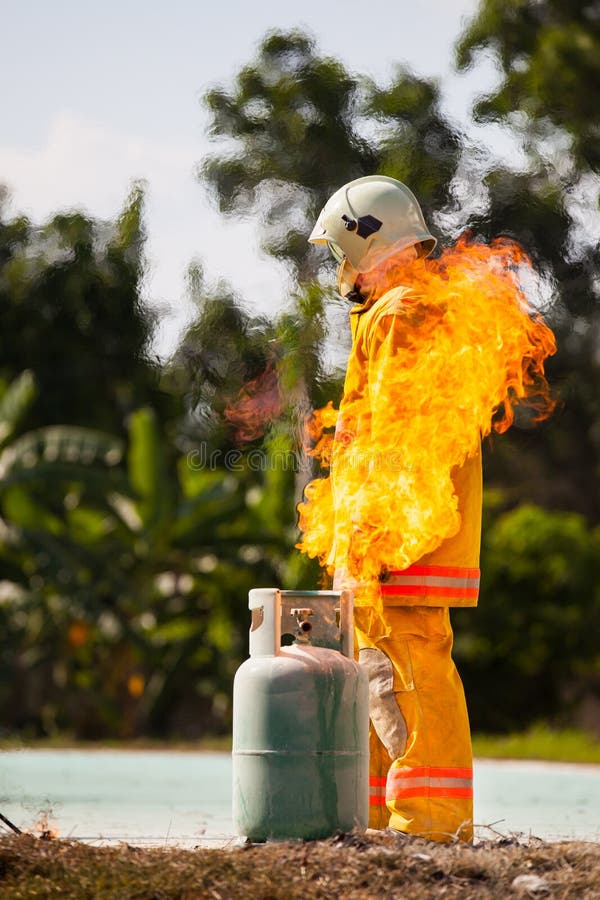 Fireman with Fire and Suit for Protect Fire Fighter Stock Image - Image ...