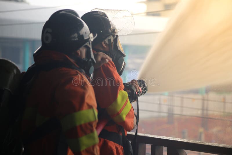 Firefighter in action stock photo. Image of damages - 125490944