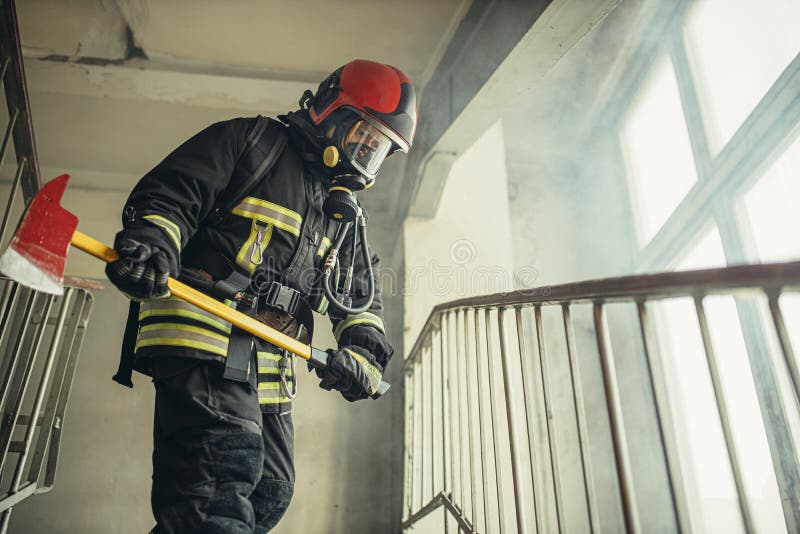 Fireman with Hammer Don`t Afraid of Danger and Fire Stock Photo - Image ...