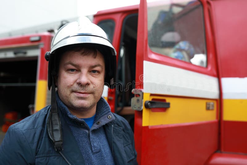Fireman near fire truck stock image. Image of real, pride - 162417159