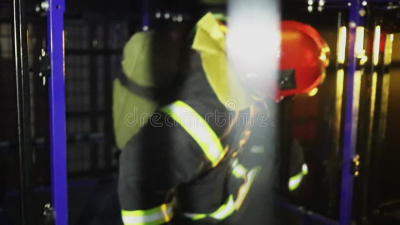 Fireman in Protective Suits Crawls in Cage of Stock Footage - Video of ...
