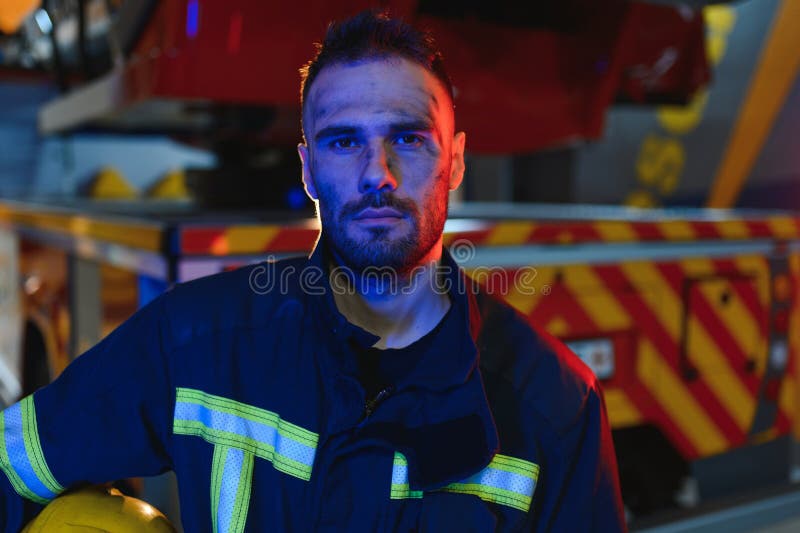 Fireman in Protective Uniform Standing Near Fire Engine on Station ...