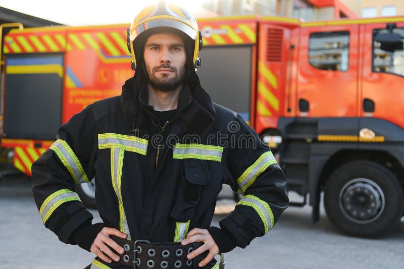 Fireman in Protective Uniform Standing Near Fire Engine on Station ...