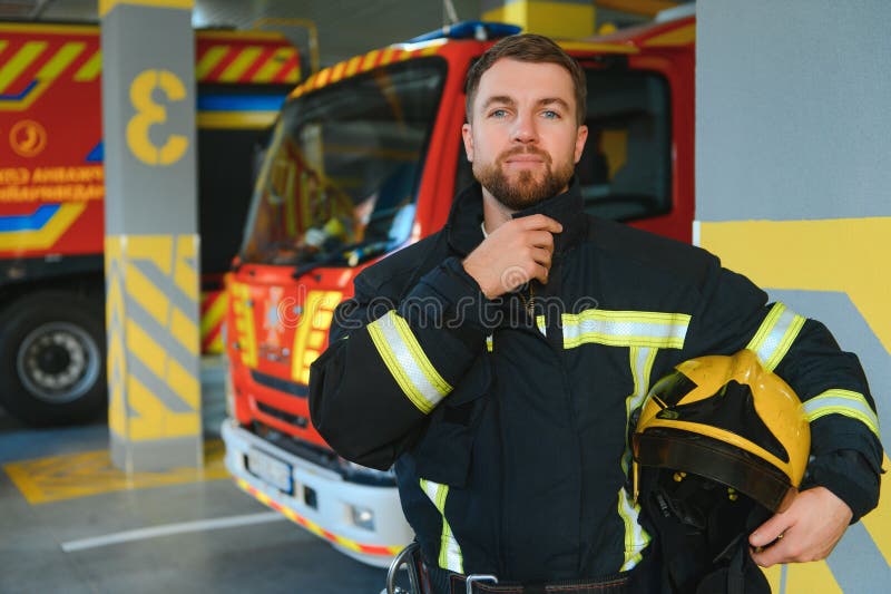 Fireman in Protective Uniform Standing Near Fire Engine on Station ...