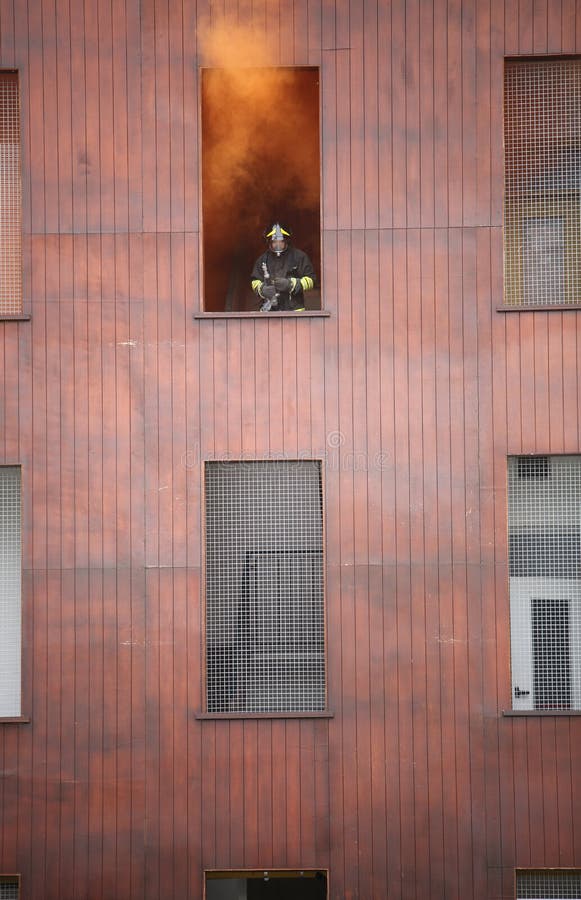 Fireman Protrudes from a Window Stock Image - Image of italia ...