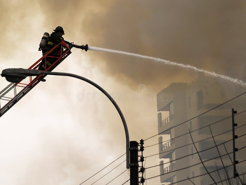 Firemen putting out a fire editorial stock photo. Image of street ...