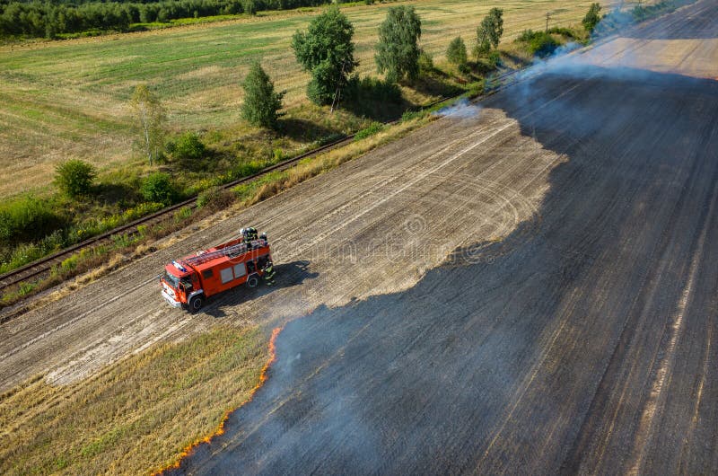 Fireman Truck Working on the Field on Fire Stock Photo - Image of corn ...