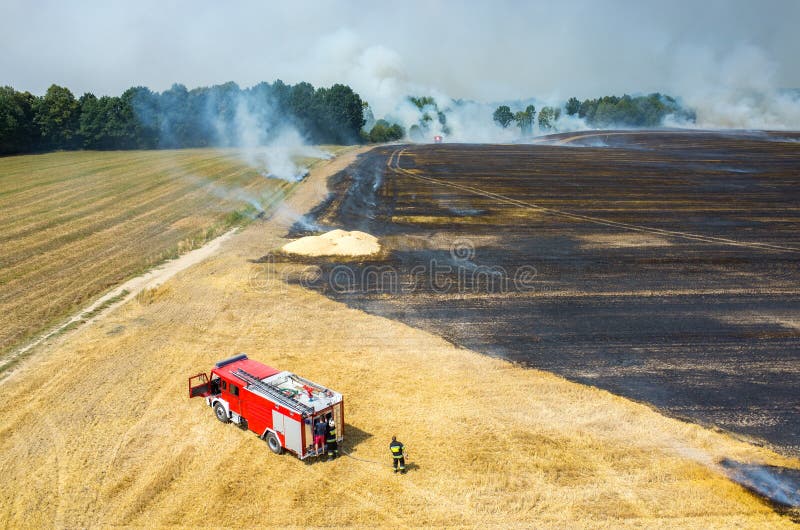 Fireman Truck Working on the Field on Fire Stock Image - Image of ...