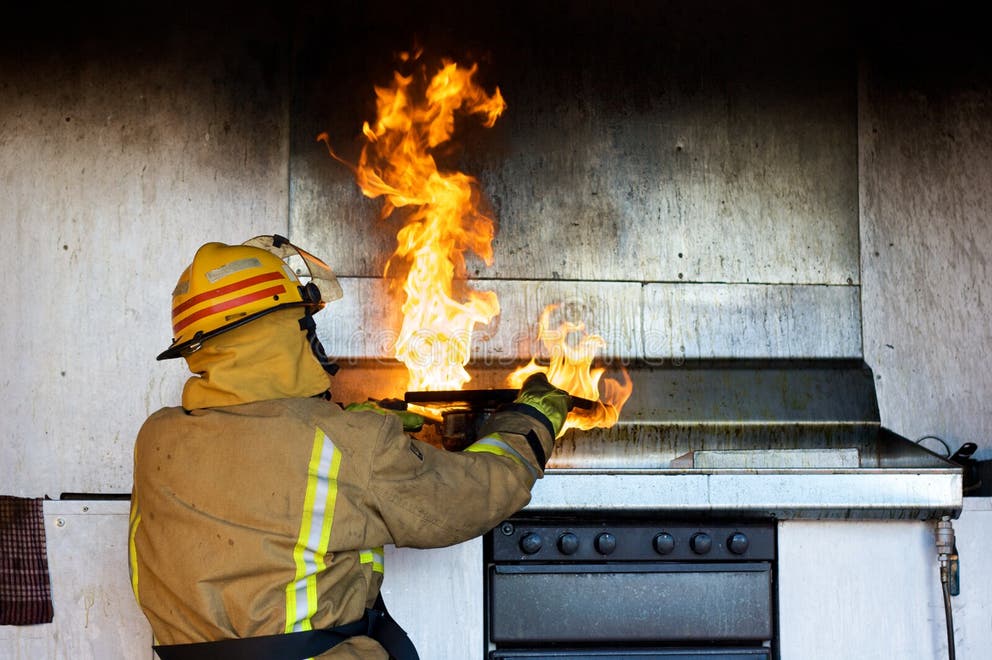 Fireman Trying To Put an Oil Fire Stock Image - Image of flame ...