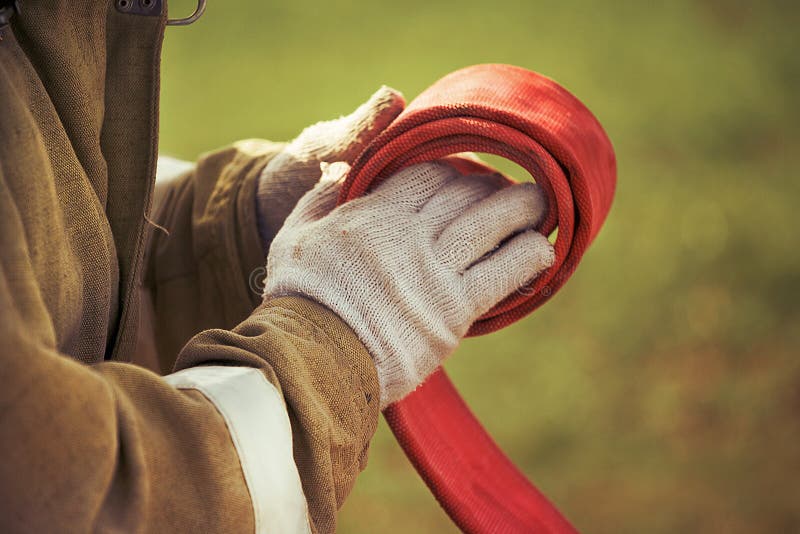 Fireman Twists Red Fire Hose. Hands Close Up Stock Image - Image of ...