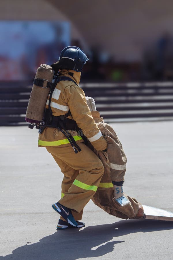 Fireman in Uniform is Dragging a Mannequin on Training Stock Image ...