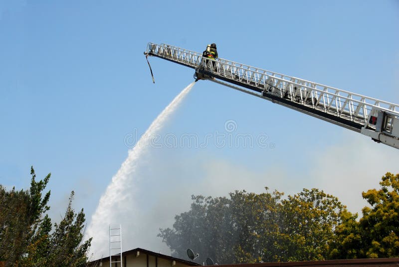 Fireman Using Water Cannon from Ladder Stock Image - Image of fire ...