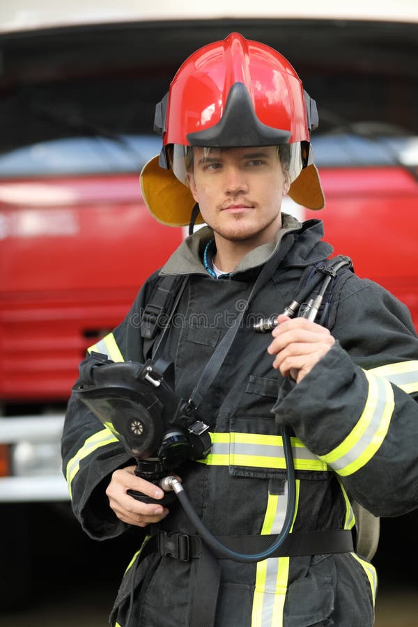 Fireman Wearing Fire Fighter Turnouts and Red Stock Photo - Image of ...