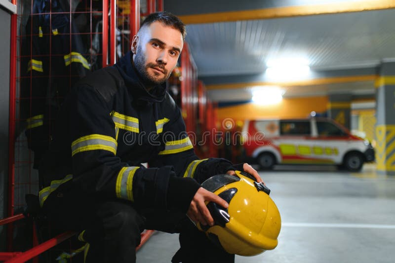 Fireman Wearing Protective Uniform Standing in Fire Department at Fire ...