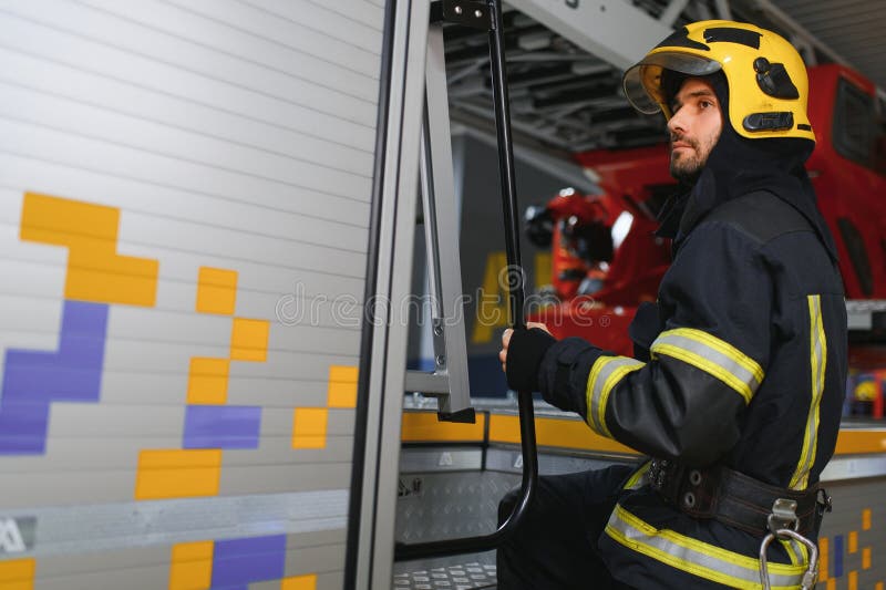 Fireman Wearing Protective Uniform Standing in Fire Department at Fire ...