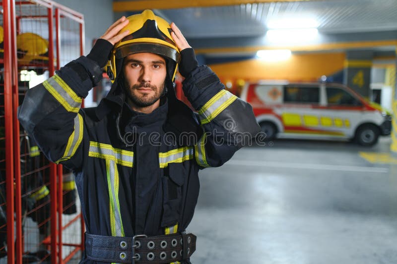 Fireman Wearing Protective Uniform Standing in Fire Department at Fire ...