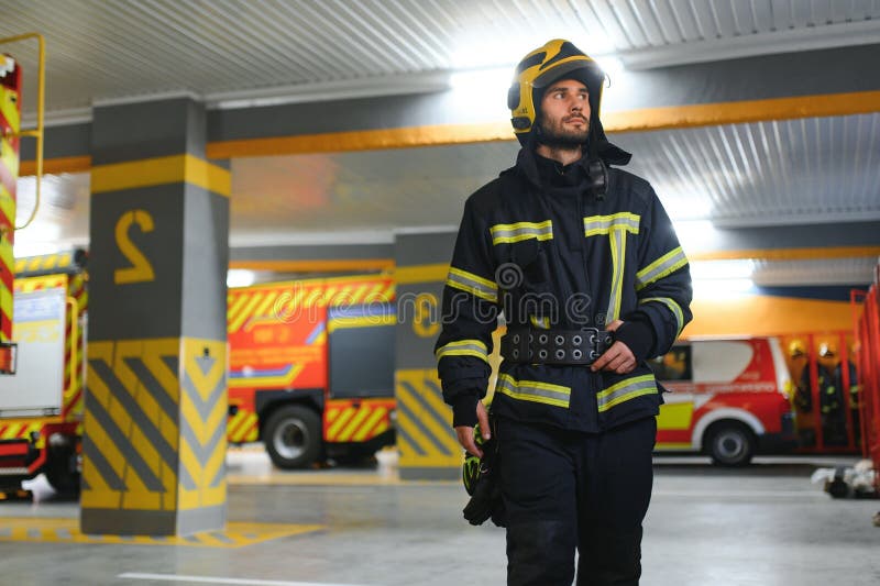 Fireman Wearing Protective Uniform Standing in Fire Department at Fire ...