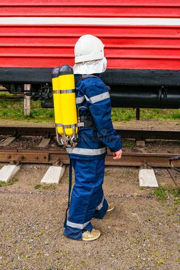 Fireman Wearing Protective Uniform Standing Next To a Fire Train Stock ...