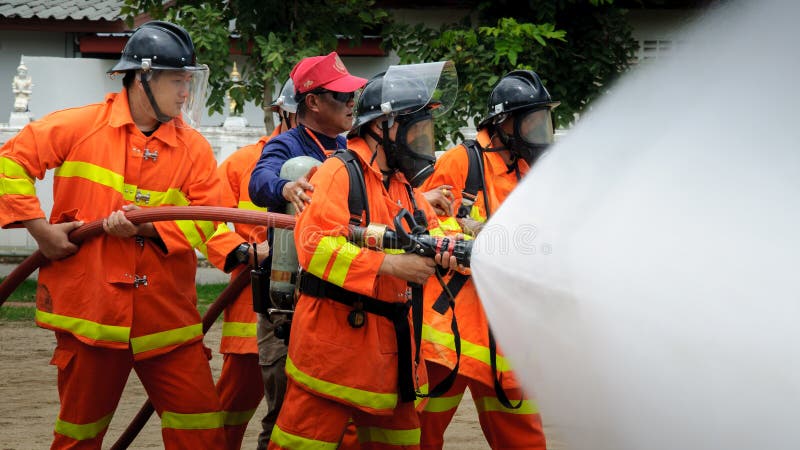 Firemen in action stock photo. Image of firefighter, fire - 19572410