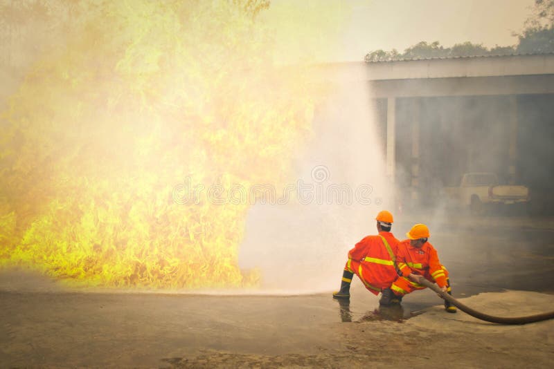 Firemen in Action Fighting Fire during Training Stock Image - Image of ...