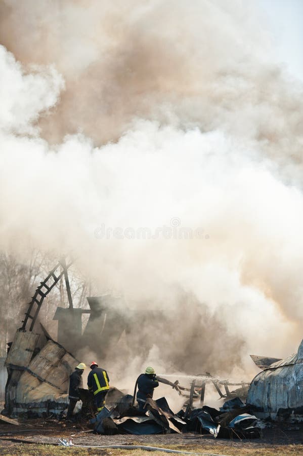 Firemen at airplane crash stock photo. Image of billowing - 22659136
