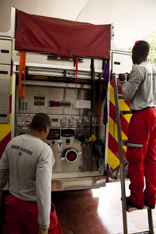 Firemen at the Back Side of a Fire Truck Editorial Image - Image of ...