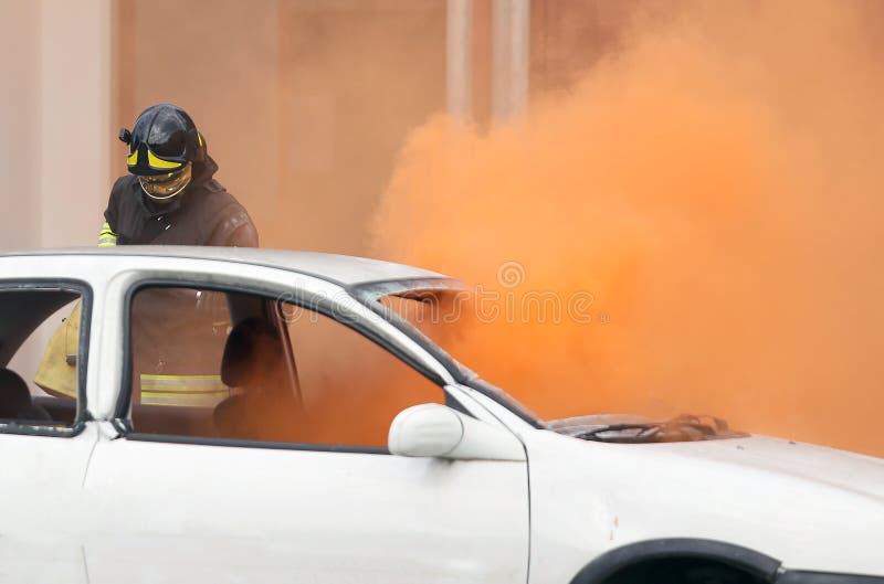 Firemen during Exercise To Extinguish a Fire in a Car Stock Image ...