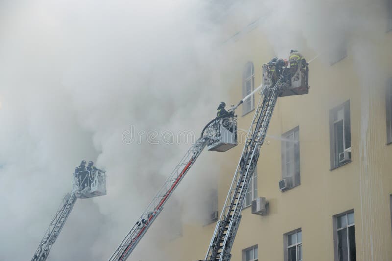 Firemen Extinguish Fire on Fire Trucks Ladders - Stock Image - Image of ...