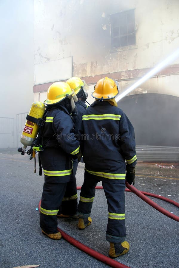 Fireman fighting a fire stock image. Image of visor, claim - 5158405