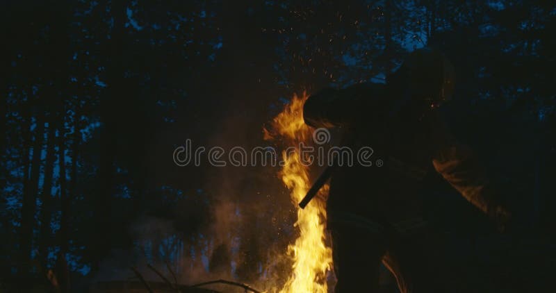 Firemen Jumping Over Fire in Dense Forest, Fire Fighter with Safety ...