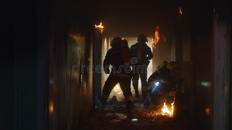 Firefighter Looking at Camera in Burning Hallway Stock Footage - Video ...