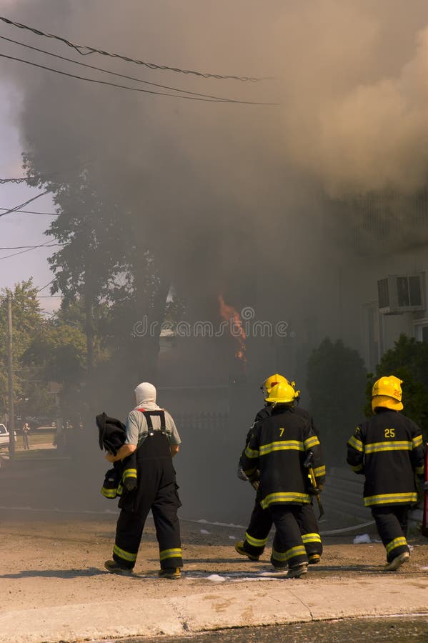 Fire fighting firemen stock image. Image of brigade, firemen - 12205949