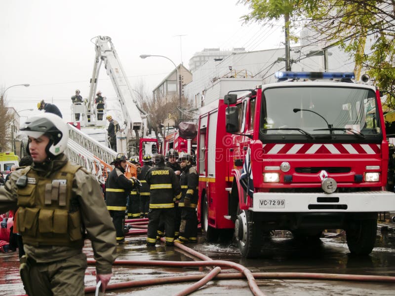 Firemen putting out a fire editorial stock photo. Image of street ...
