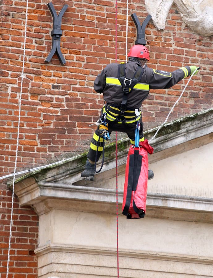 Firemen during Rescue Operations with a Wooden Ladder Editorial Stock ...
