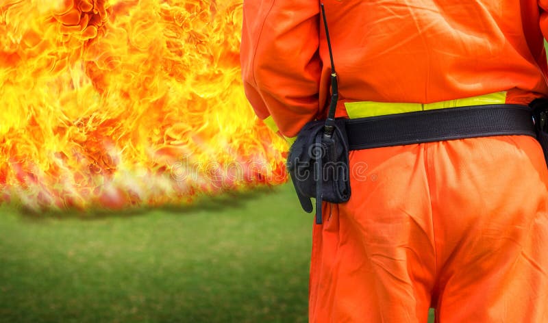 Firemen Standing in Front of a Big Flame Stock Photo - Image of alarm ...