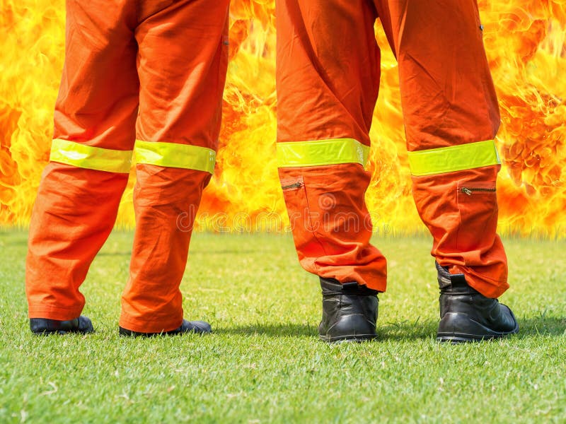 Firemen Standing in Front of a Big Flame Stock Image - Image of orange ...