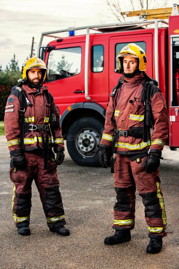 Firemen Standing Next To Fire Truck. Stock Photo - Image of confidence ...