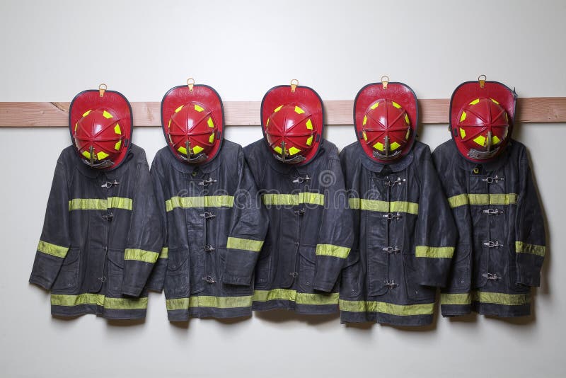 Firemen suits and helmets stock image. Image of firefighter - 23504007