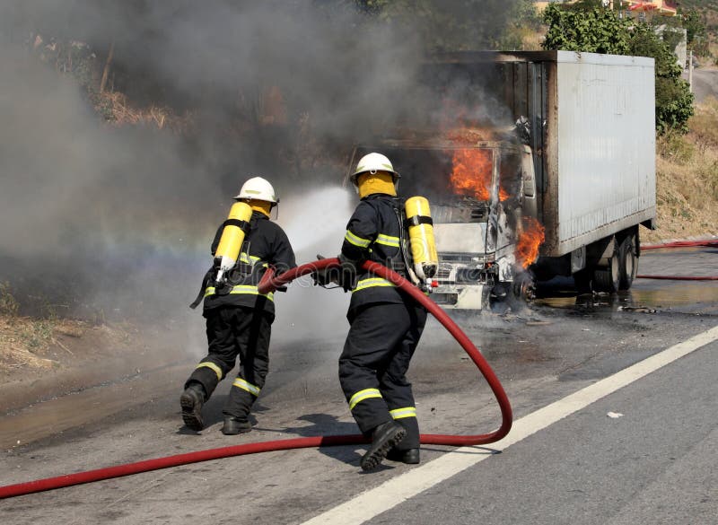 Firemen editorial photography. Image of blaze, team, water - 65691052