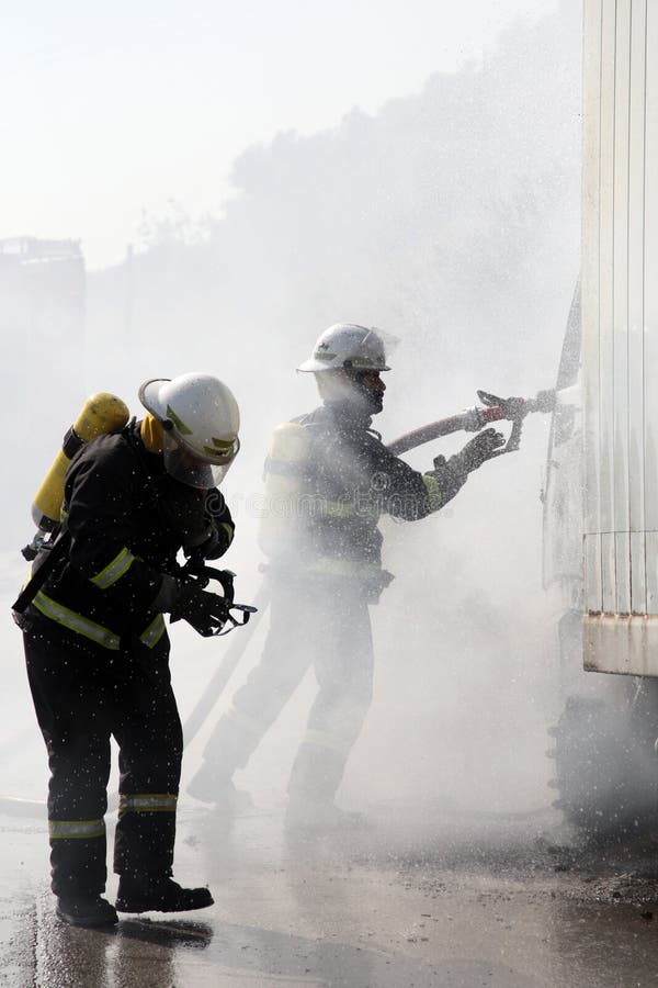 Firemen editorial stock image. Image of safety, yellow - 65691054