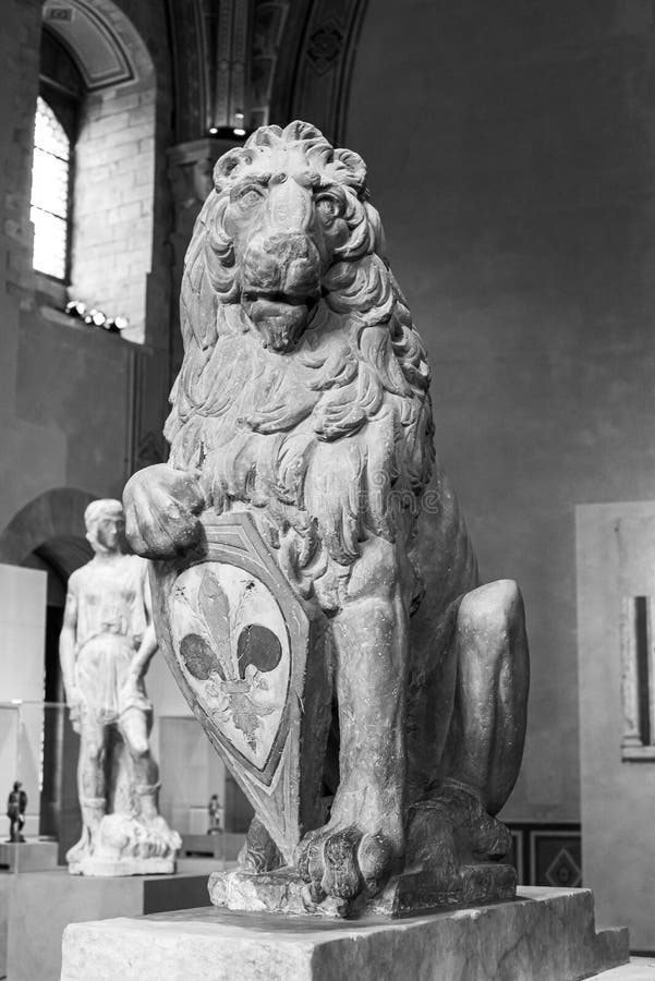 Black and White Photo of Stone Statue of Lion Holding a Shield Inside ...