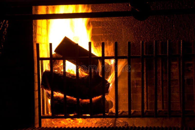 Burning Logs stock photo. Image of flame, energy, fireplace - 294710