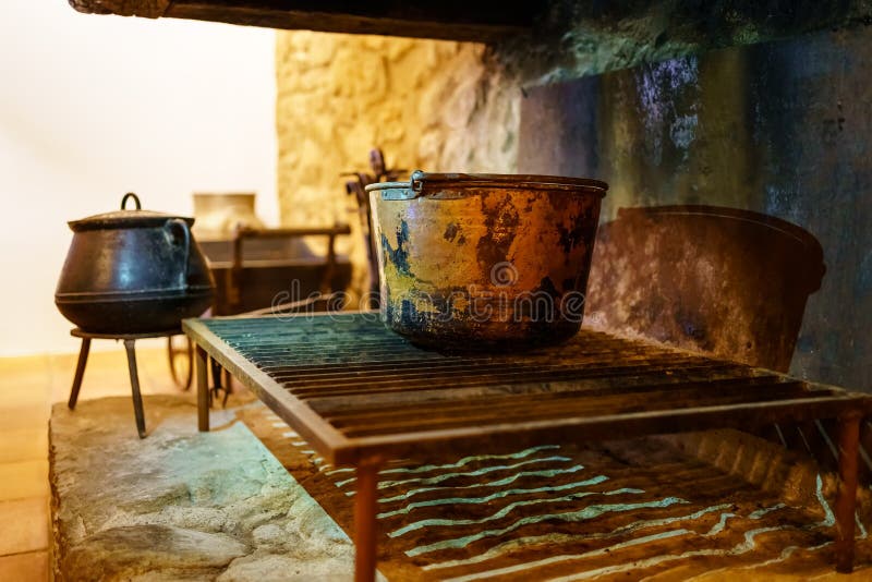 Fireplace with Large Pots and Cooking Utensils with Fire in an Old ...