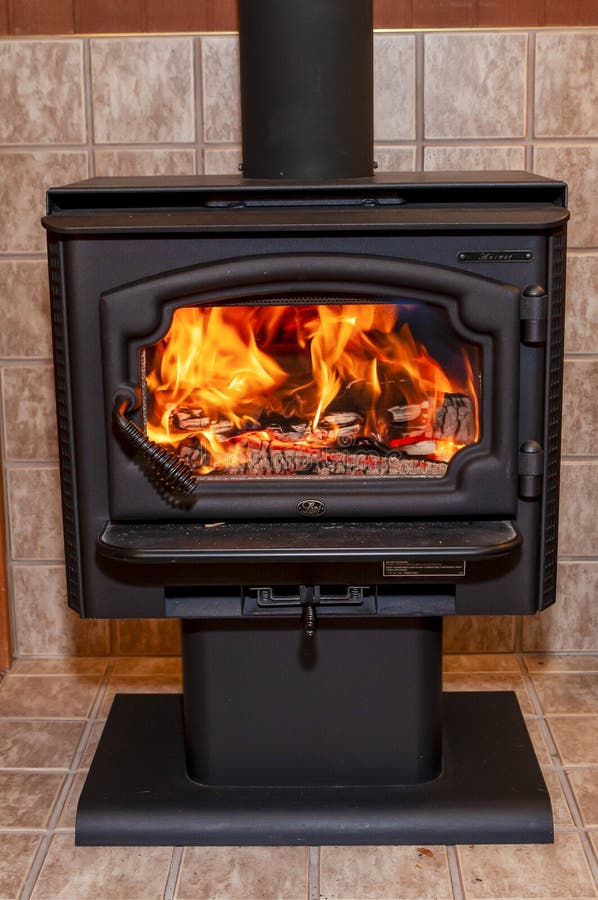 Fireplace with a Roaring Fire Inside Stock Image - Image of heater ...