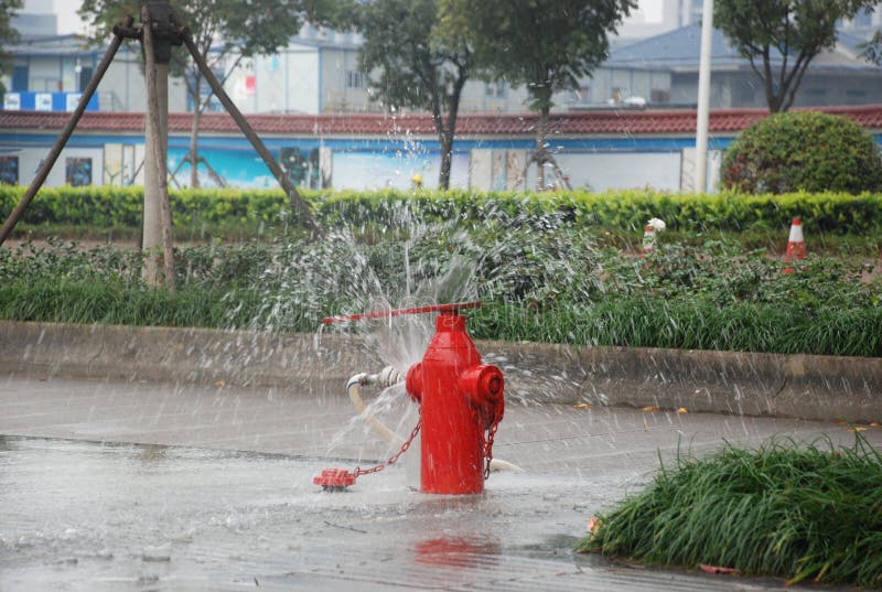 Fireplug is Opened and Water Fontains Out on the Road Stock Photo ...