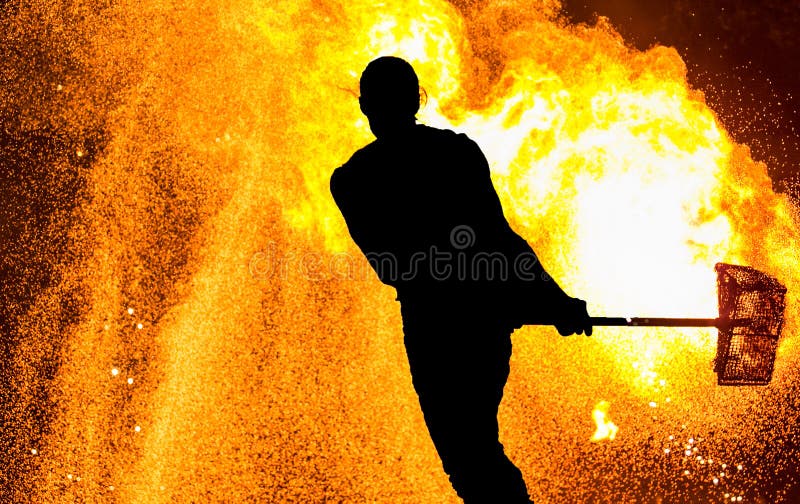 Fireshow Performance. Silhouette of Man with Hammer Stock Photo - Image ...